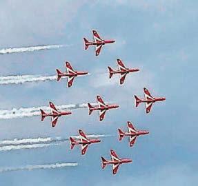 Thousands gather to see Red Arrows and Spitfire at airshow | Western ...