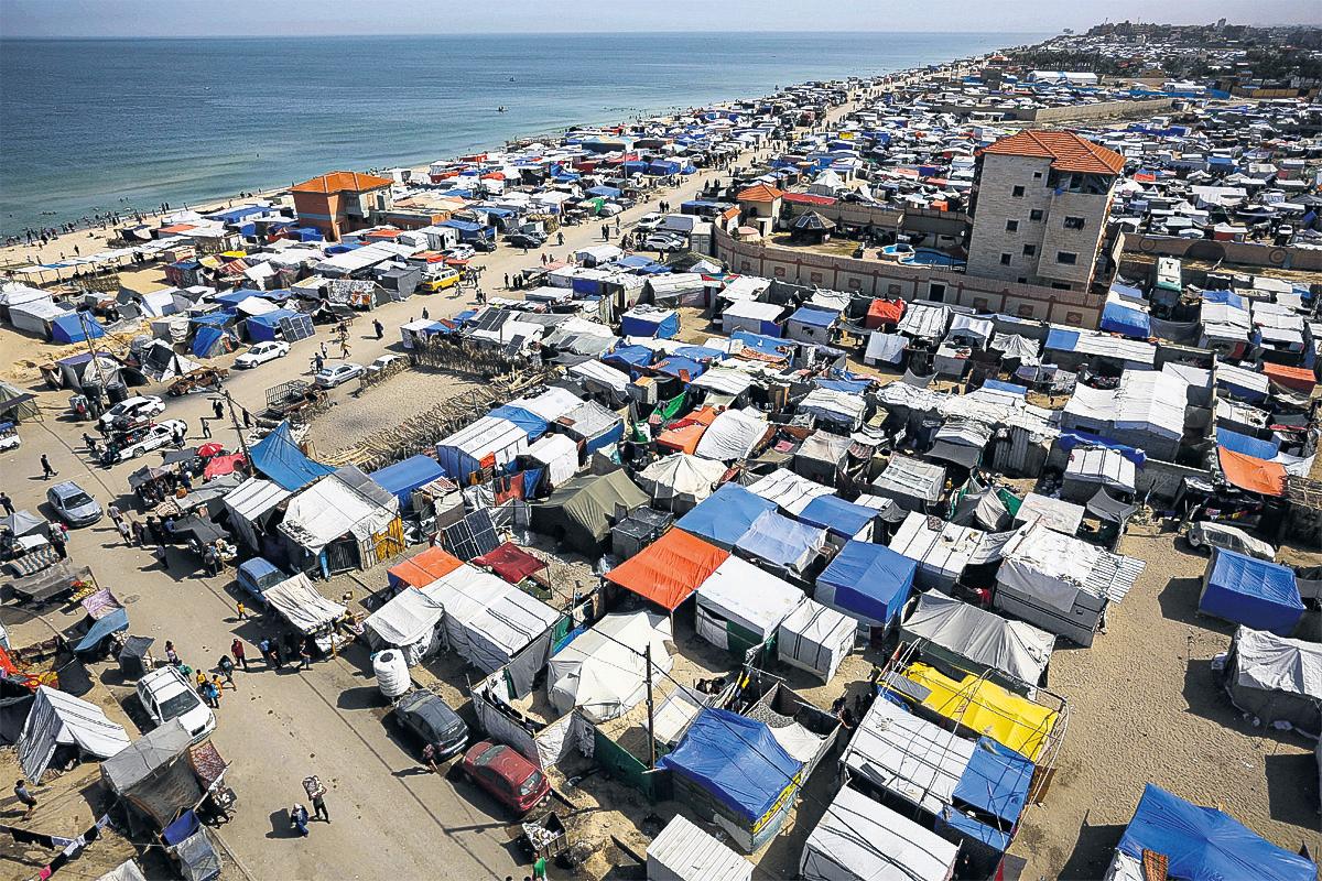 "Today we flee again' Palestinians seek safety from strikes on Rafah ...